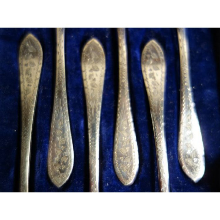 12 vintage silver plated tea spoons and sugar tongs.